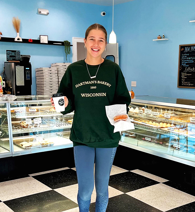 The face of happiness! This friendly staff member is ready to guide you through Hartman's sugary wonderland. Trust her &ndash; she knows where the good stuff is.