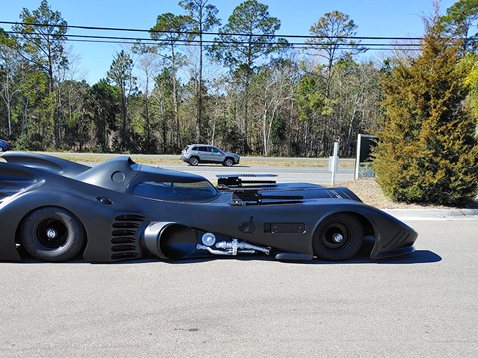 Holy classic cars, Batman! This sleek, black beauty looks ready to fight crime and win style points. Adam West would be proud!