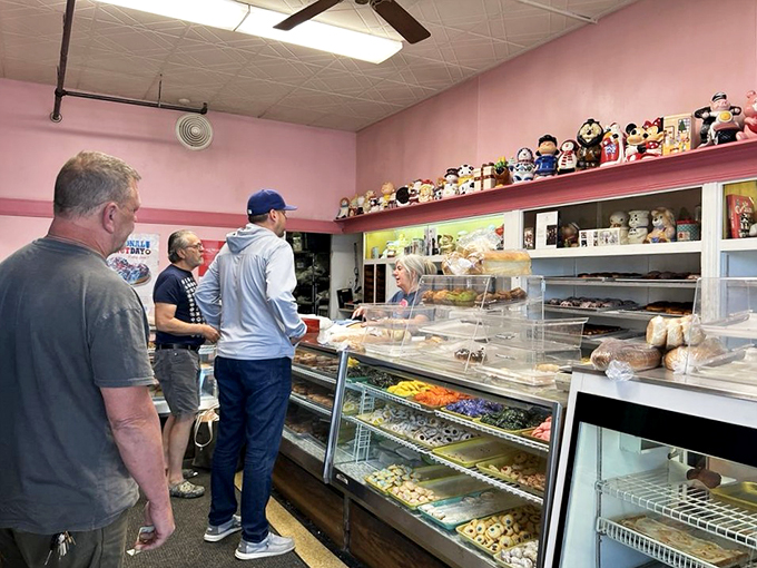 Step right up to donut paradise! These lucky customers are about to embark on a sweet adventure that'll make their dentists weep and their taste buds rejoice.