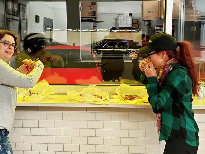 Happy customers, steamy windows, and hot dogs galore. It's like a Norman Rockwell painting, but with more mustard.