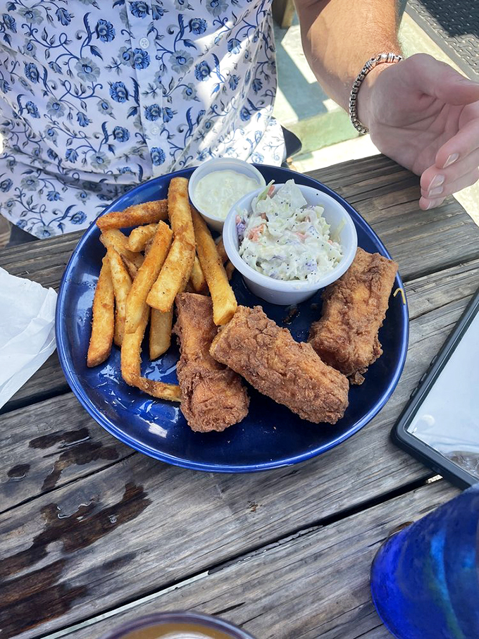 Fish so crispy, it could audition for a potato chip commercial. Paired with fries that are more golden than Fort Knox.
