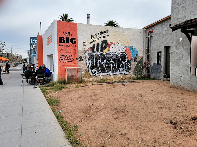 Alfresco dining with a side of street art. Because nothing says "hip breakfast joint" like enjoying your eggs next to graffiti.