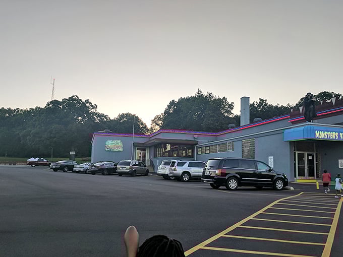 "Even monsters need parking! This lot might look ordinary, but rumor has it cars have been known to mysteriously change color after dark. Spooky or just really efficient valet service?"