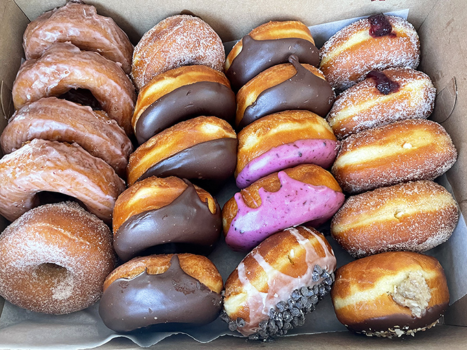 A box of joy featuring chocolate-dipped dreams and sugar-dusted delights. Decision paralysis never looked so good.