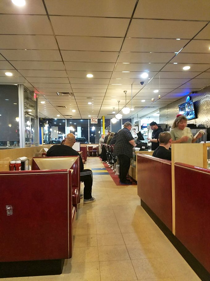 Red booths, chrome accents, and a side of nostalgia. This dining area is a time machine fueled by pancakes and bacon.