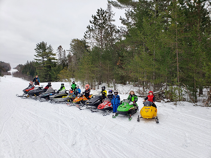 Start 'em young! These pint-sized powder hounds are getting a taste of snowmobile fever early.
