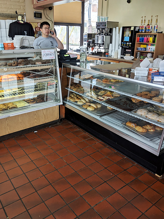 The wizard behind the curtain. This dedicated staff member ensures your donut dreams come true, one pastry at a time.