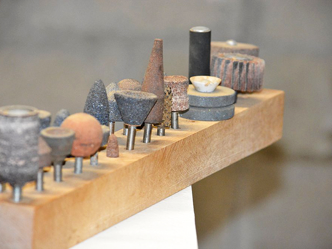 The tools of the trade lined up like soldiers, ready to help bring another wooden bird to life.