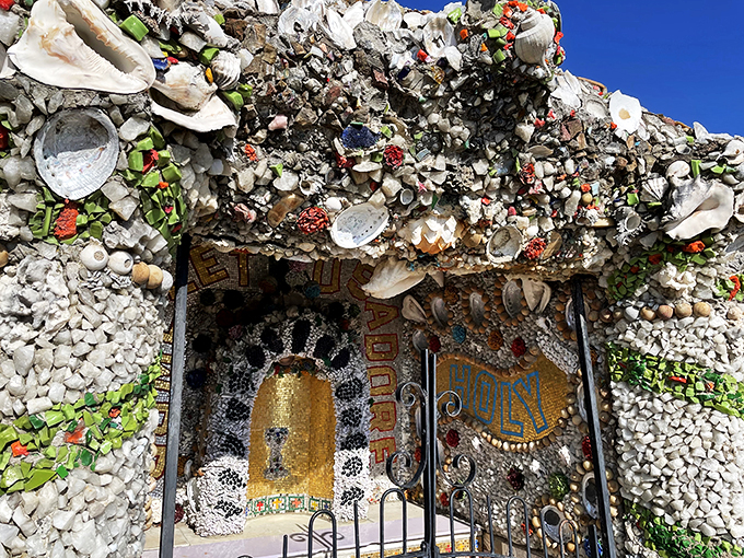 Peek-a-boo, I see you! This intricate doorway is like a portal to Narnia, if Narnia were made entirely of pebbles and seashells.