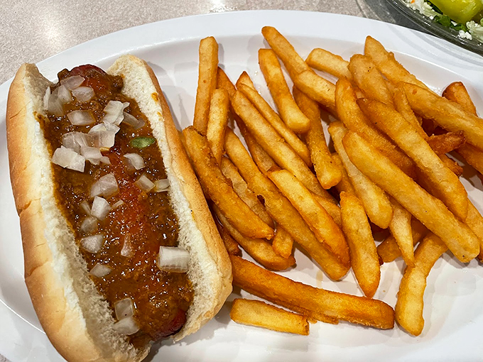 The classic coney dog, elevated to art form. It's a flavor explosion that would make even the pickiest eater weak at the knees.