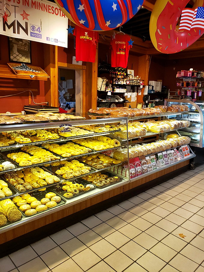 Feast your eyes on this kaleidoscope of carbs! It's like a treasure chest, but instead of gold, it's filled with donuts.