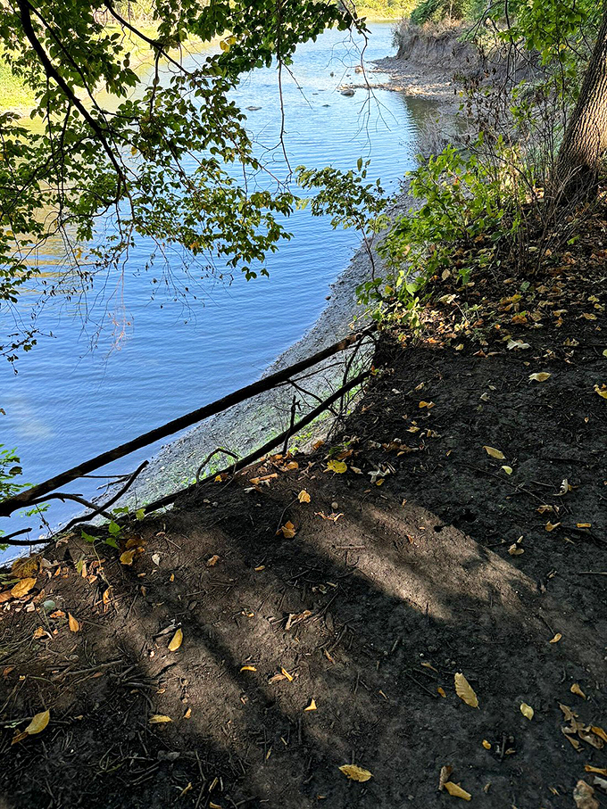 Water, earth, and sky collide in this serene scene. It's like nature's own infinity pool, minus the chlorine and noisy pool parties.