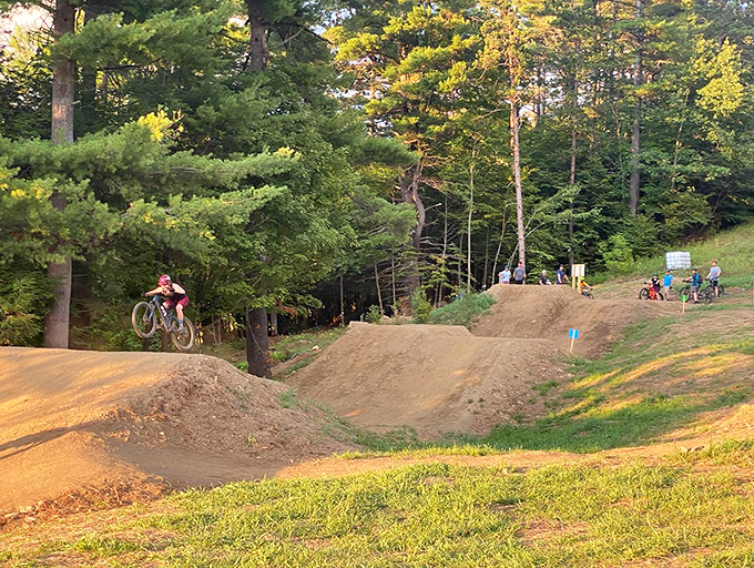 Catching air at Ascutney Trails! Sunny summer evening sessions on the West Windsor bike jumps.