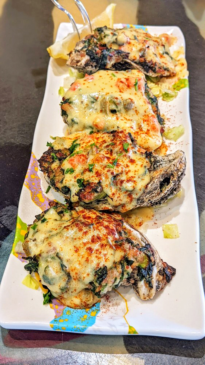 These baked oysters are so cheesy, they could write their own dad jokes. A seafood lover's dream, served with a side of indulgence.