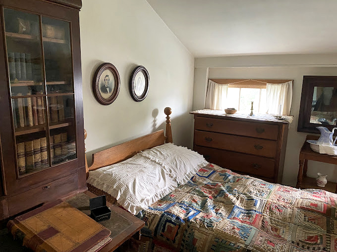 Sleep like it's 1899! This cozy bedroom proves that comfort never goes out of style, even if indoor plumbing does.