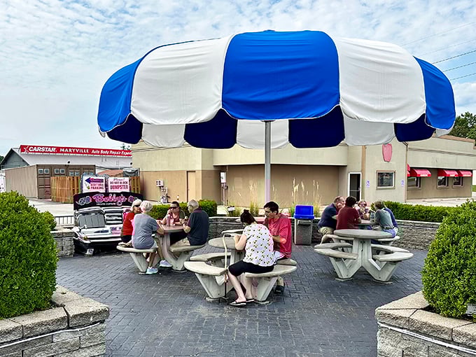 Happy customers under a big umbrella: It's like a support group for custard addicts, and everyone's welcome!