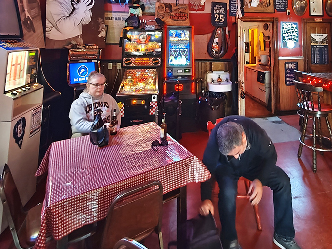 Who needs modern entertainment when you've got vintage pinball and checkered tablecloths? It's like your cool grandpa's basement, but better!
