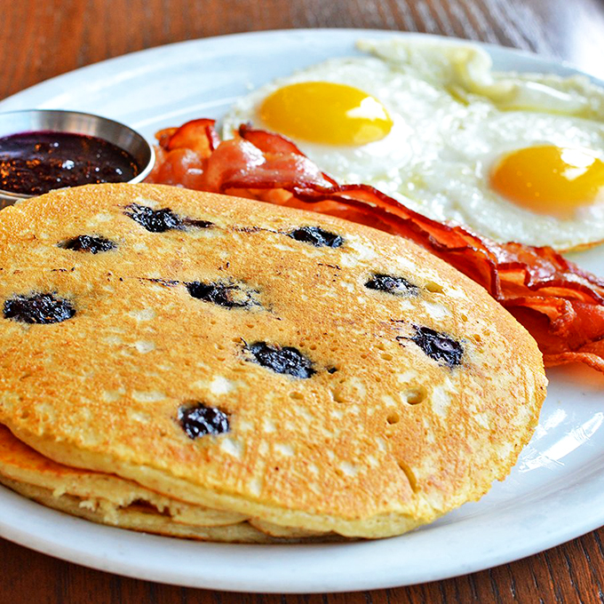 Pancake perfection! These flapjacks are so fluffy, they might float away if not anchored down by crispy bacon and sunny-side-up eggs.