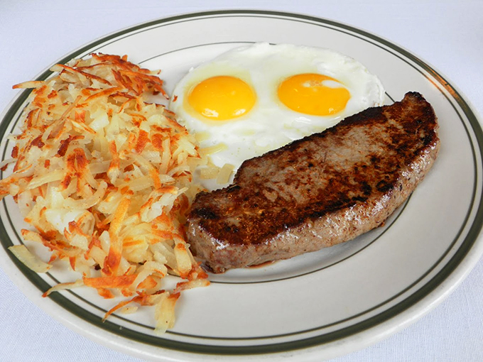 The breakfast of champions! This plate is bringing its A-game with eggs sunny side up and hash browns crispy enough to make a potato proud.