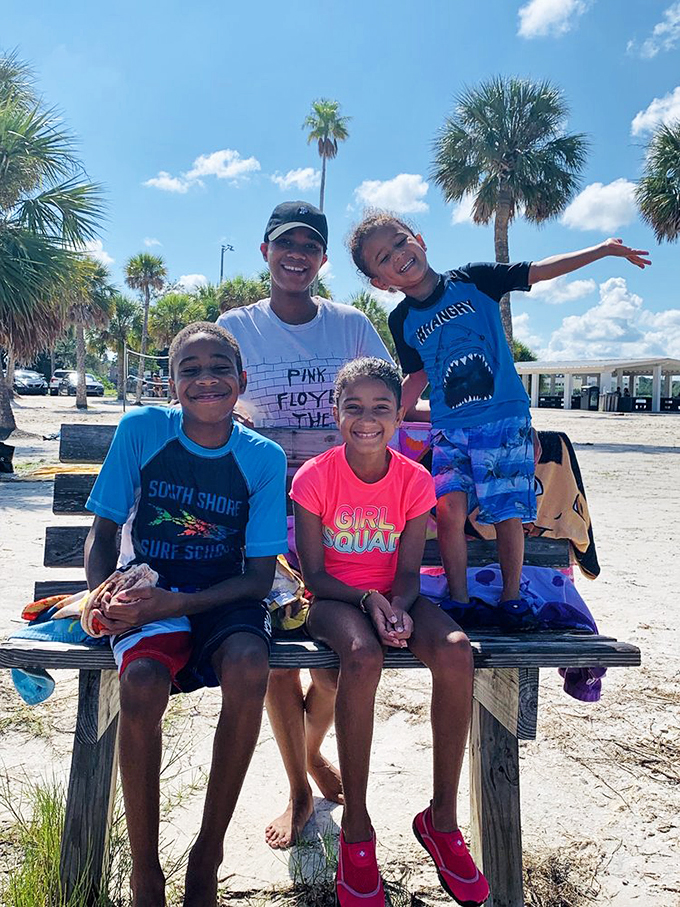 Beach day or impromptu family photo shoot? Why not both! These smiles are brighter than the Florida sunshine.