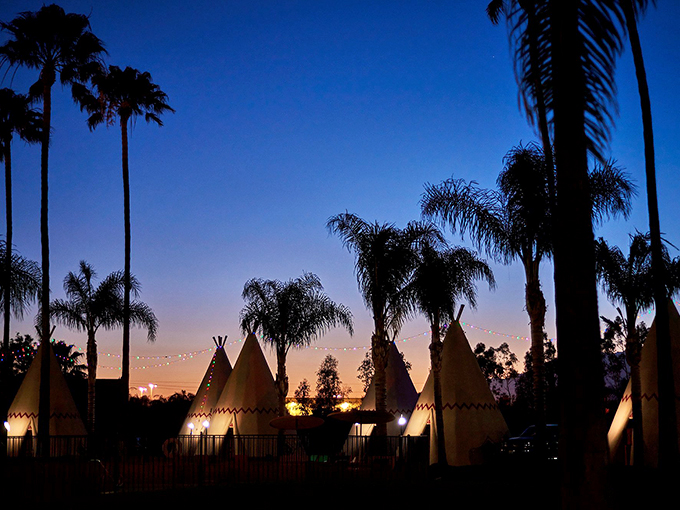 As night falls, the Wigwam Motel transforms into a magical wonderland. It's like Vegas met a summer camp and decided to settle down in Arizona.