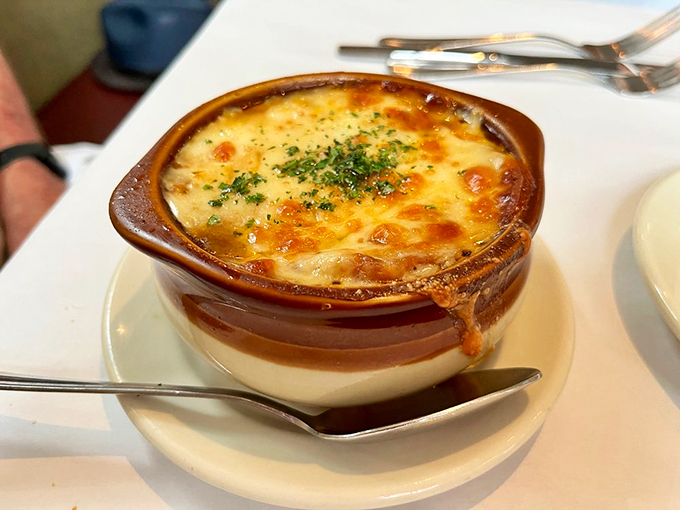 This isn't just soup, it's a warm hug in a bowl! French onion soup so good, it'll make you want to cancel your flight to Paris.