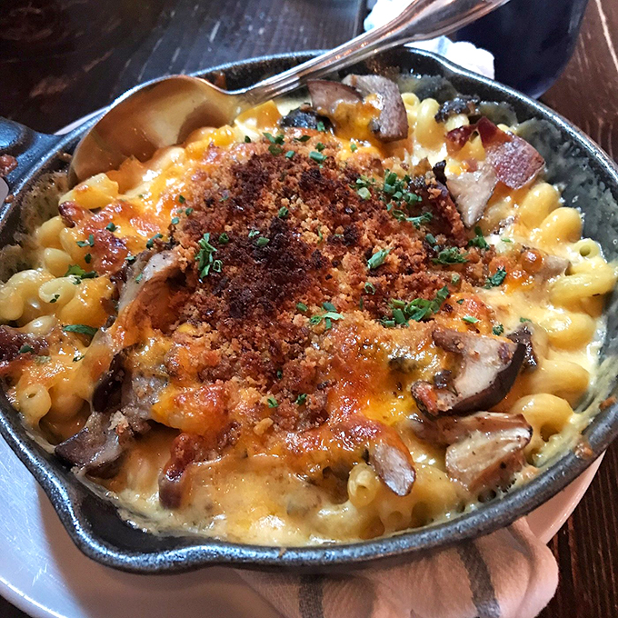 Mac and cheese that's cheesier than your uncle's jokes at Thanksgiving. This skillet of gooey goodness is comfort food elevated to an art form.