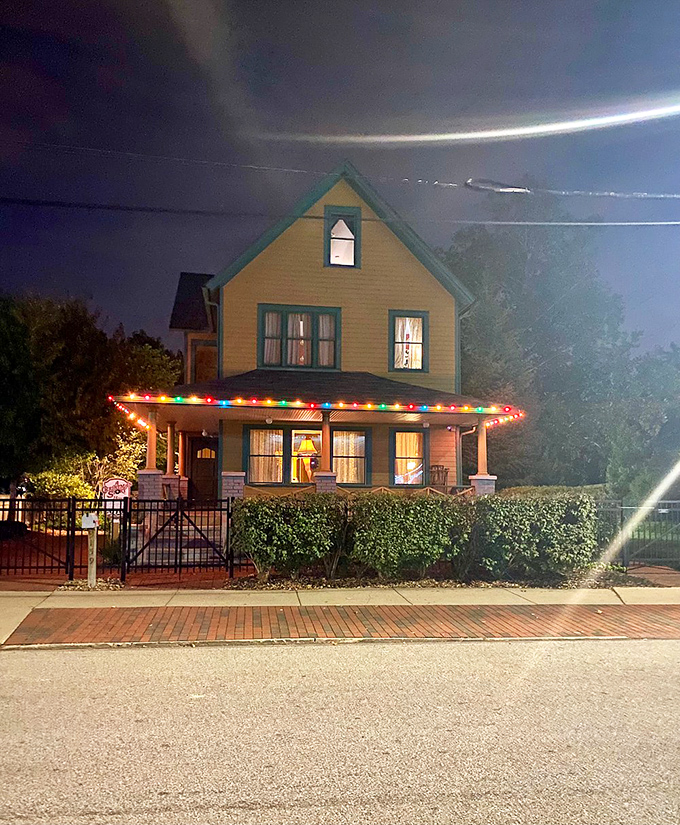 Night falls, but the Christmas spirit never sleeps. The house glows like a beacon of holiday cheer.
