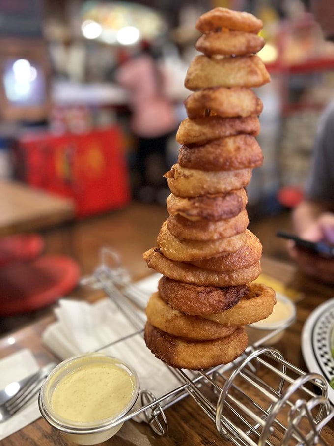 The Leaning Tower of Onion Rings - a crispy, golden monument to fried perfection. It's architecture you can eat!