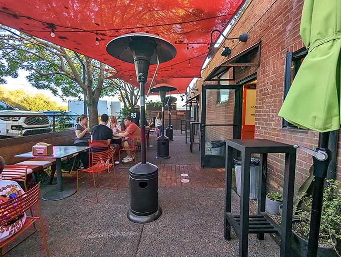 Red umbrellas stand guard against the sun, ensuring your ice cream doesn't become a milkshake before you're ready.