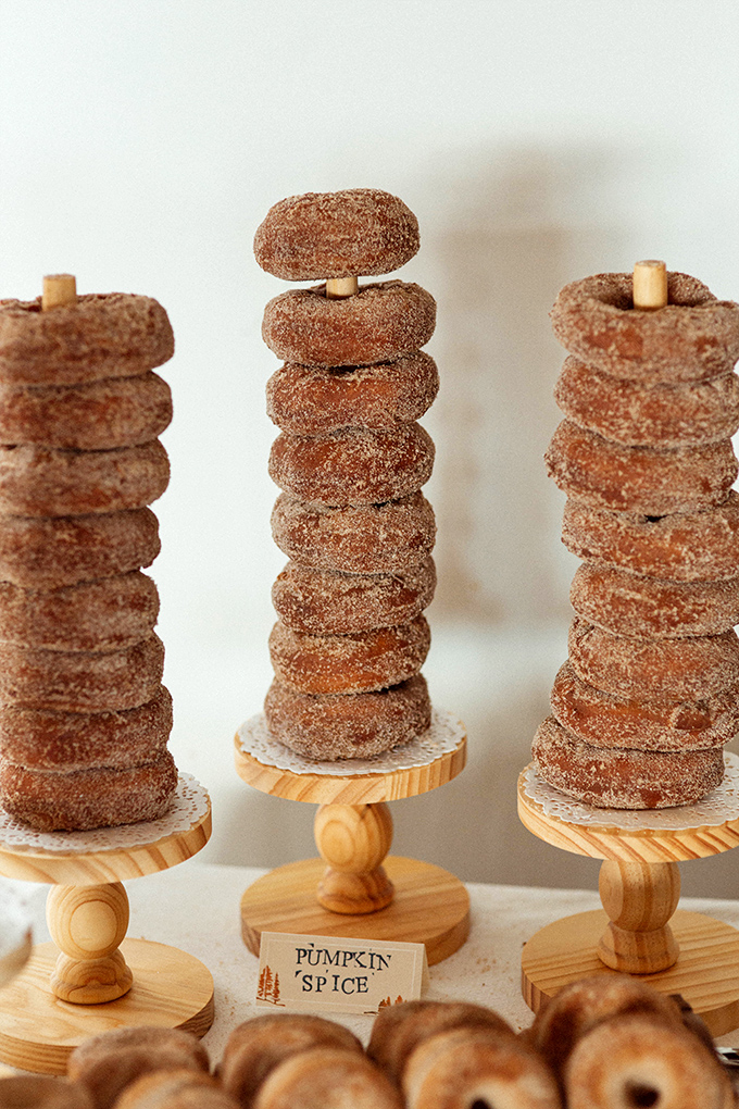 Pumpkin spice donuts stacked like delicious Jenga towers. Fall flavors reaching new heights of temptation.