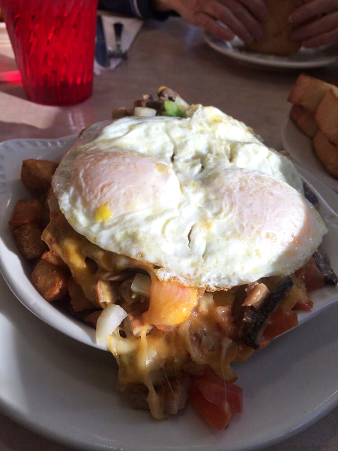 Behold, the Everest of breakfast! This skillet creation dares you to conquer its cheesy, eggy peaks. Bring your appetite and leave your diet at the door.