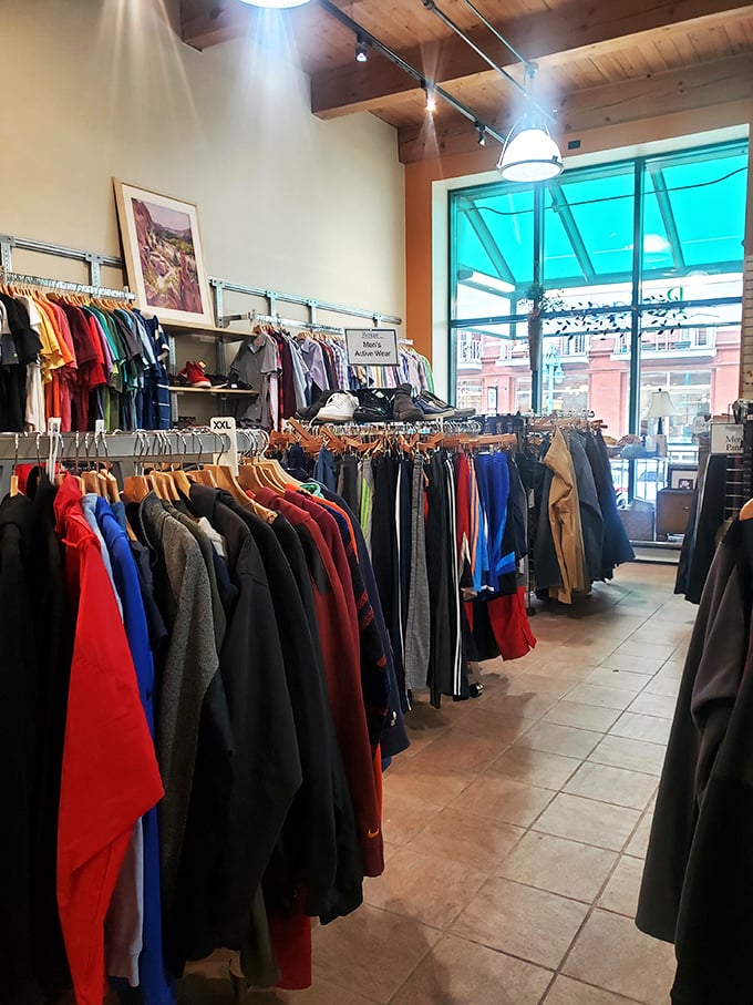 A rainbow of retail therapy! This colorful aisle of clothing is like walking through a wardrobe wonderland. No magical wardrobes required!