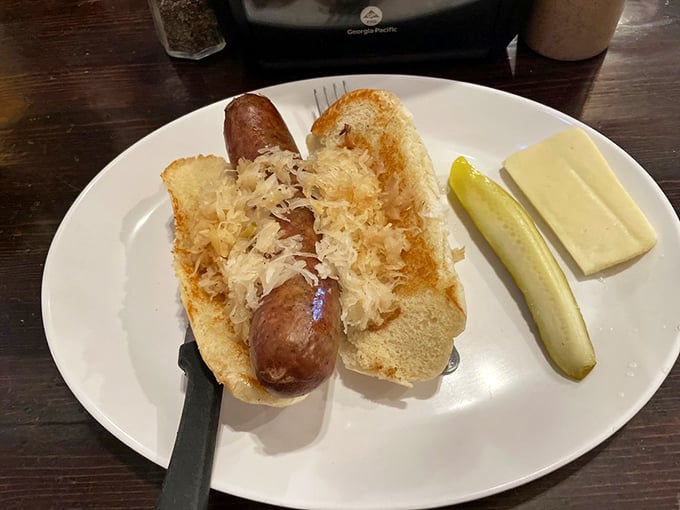 The bratwurst that launched a thousand sighs. Nestled in a pillowy bun with sauerkraut, it's a taste of Wisconsin bliss.
