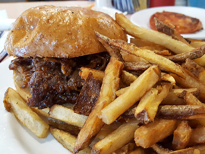Burger or edible skyscraper? This towering creation is a testament to the architectural wonders possible between two buns.
