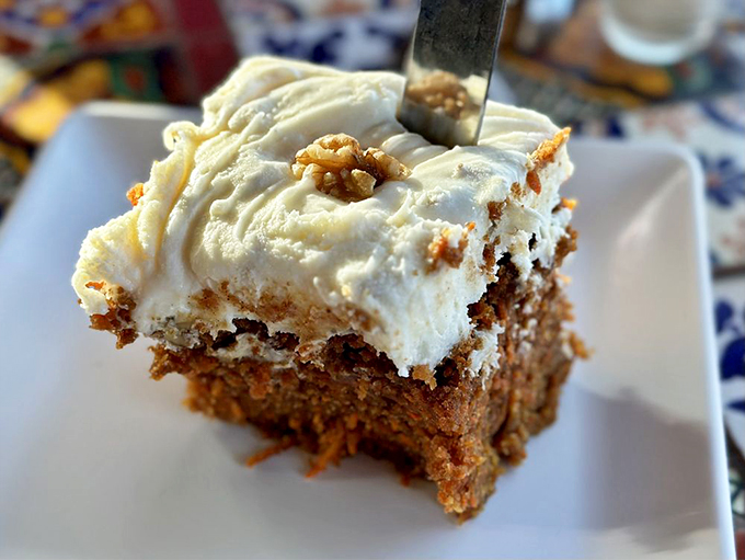 Layers of happiness wrapped in cream cheese frosting. This cake doesn't just satisfy cravings; it creates memories. Fork optional, joy guaranteed.