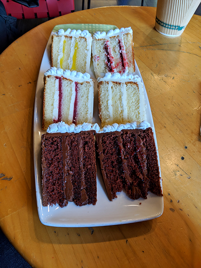 A cake sampler that's more colorful than a 1960s TV test pattern. Each slice is a different channel of deliciousness!