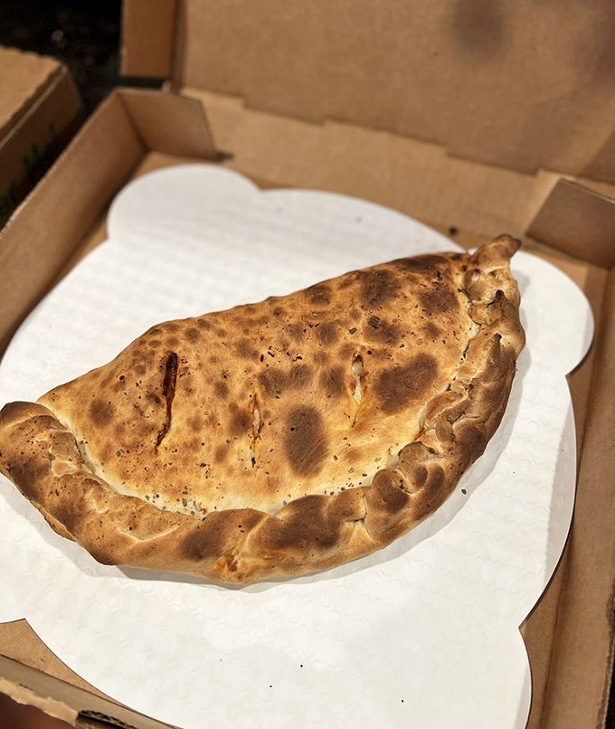 Is it a pizza? Is it a sandwich? No, it's super calzone! Packed with more filling than your grandma's photo albums.
