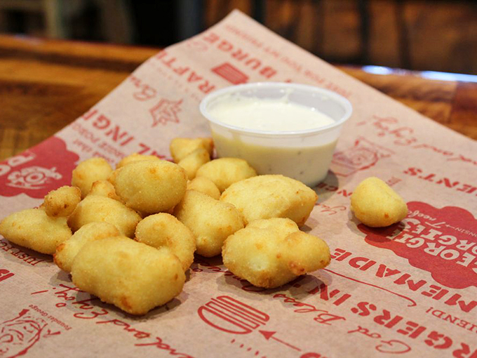 Wisconsin's favorite snack gets the royal treatment! These cheese curds are crispy, gooey nuggets of pure joy.