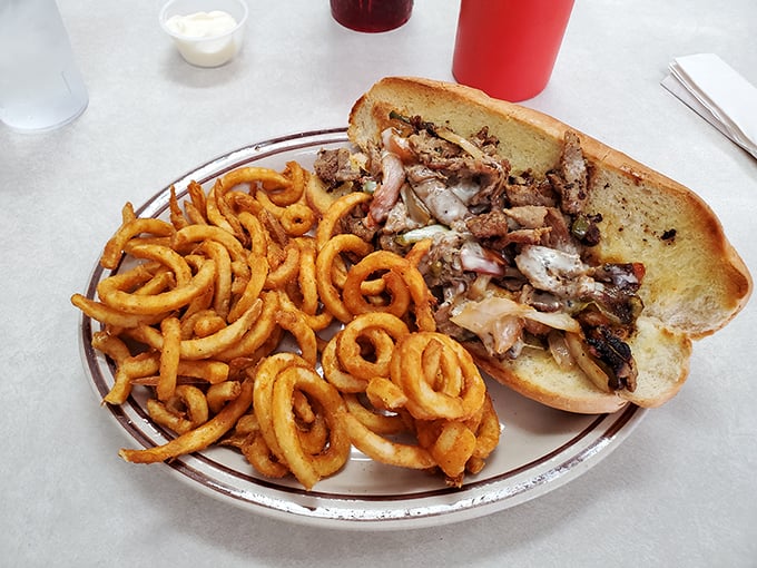 A sandwich that's more loaded than your great-aunt's stories at Thanksgiving. This cheesesteak is a delicious reason to dislocate your jaw.