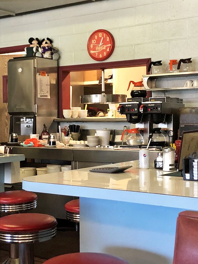 Where the magic happens! This bustling counter is like a front-row seat to a delicious culinary concert, complete with the sizzle of the grill and the aroma of fresh coffee.