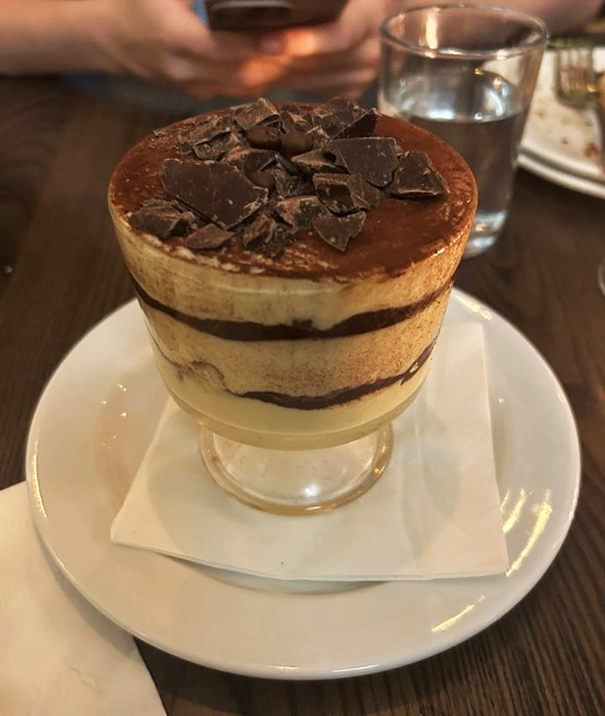 Dessert that defies gravity! This towering tiramisu is a testament to the power of coffee, cocoa, and dreams. Spoon at the ready? Dive in!