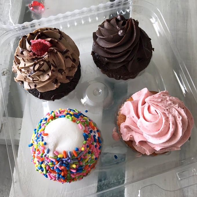 A quartet of cupcake perfection. From sprinkle-topped to chocolate-drizzled, these little cakes are like edible works of art.