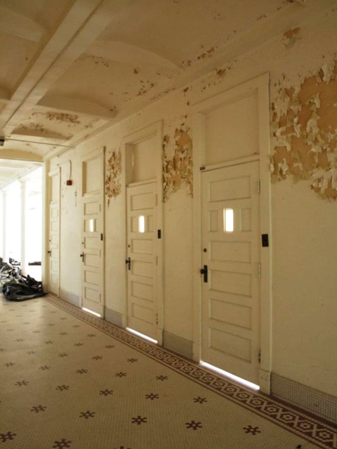 "Doors of perception, asylum edition." Each door holds secrets, but you might not want to knock. The world's creepiest advent calendar, perhaps?