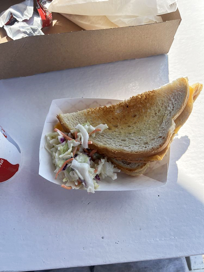 The humble grilled cheese gets a Maine makeover. Paired with that crisp slaw, it's comfort food that's had a glow-up.
