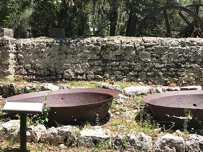 Giant iron bowls: once filled with bubbling sugar, now brimming with history. These kettles could tell tales sweeter than any bedtime story.