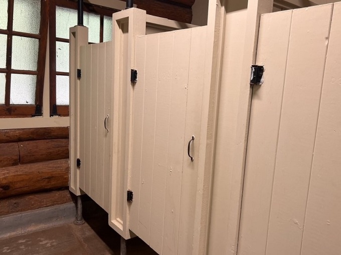 Even in the great outdoors, some doors are best left closed. But hey, at least they match the rustic vibe!