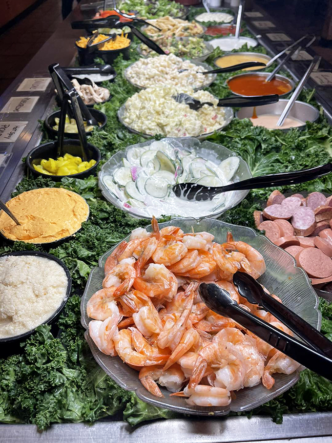 The salad bar: where good intentions meet delicious reality. Don't worry, the lettuce cancels out the bacon bits.