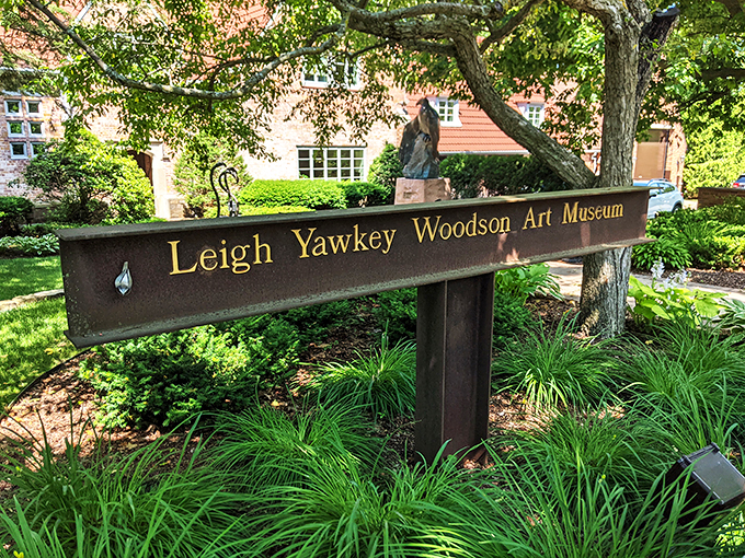 The gateway to wonder! This unassuming sign marks the entrance to a world where art and nature dance in perfect harmony.