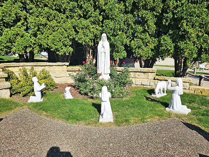 A congregation of the holy and stony. These statues look like they're having the world's quietest, most reverent garden party.